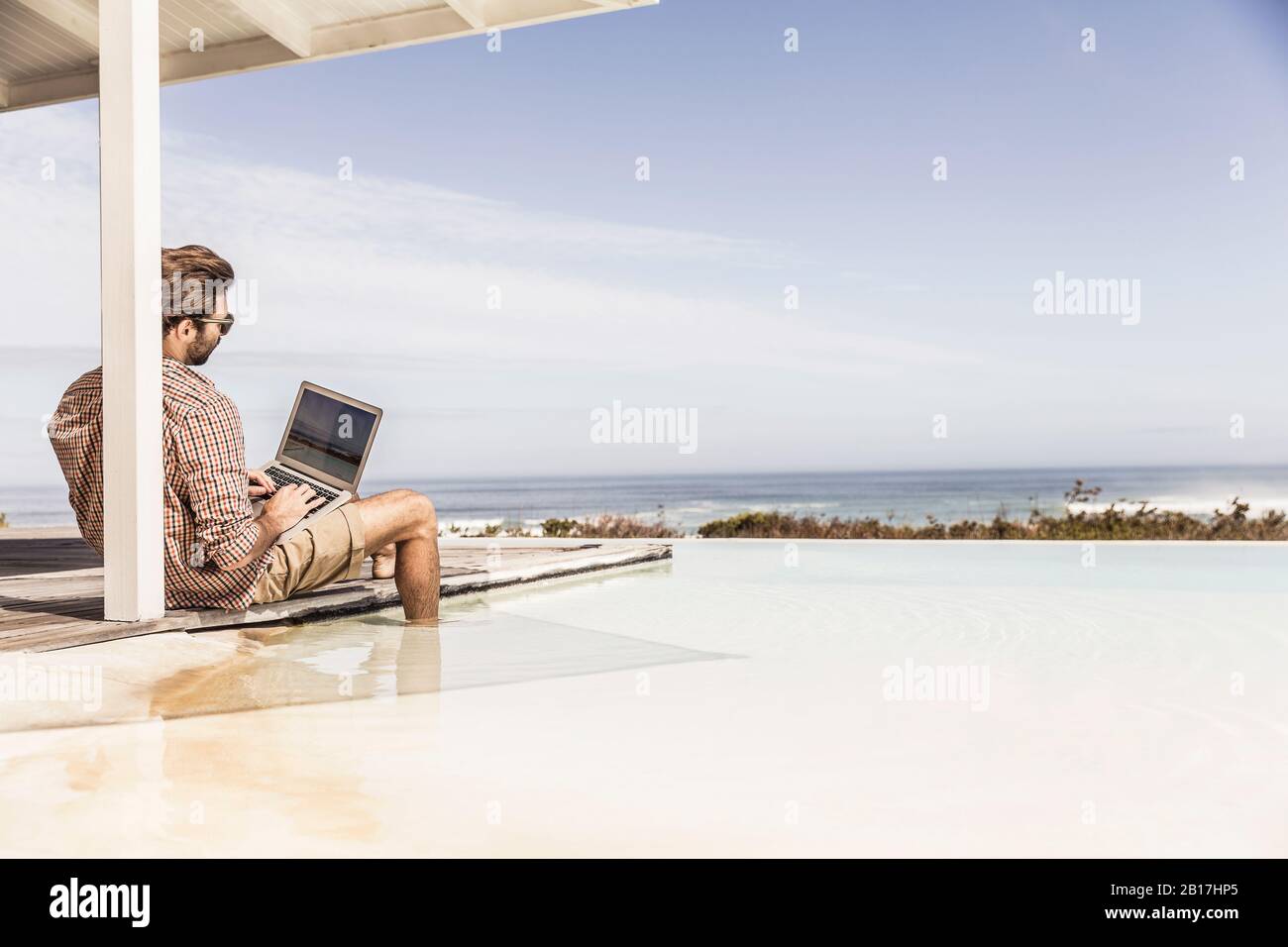 Laptop by the pool hi-res stock photography and images - Alamy