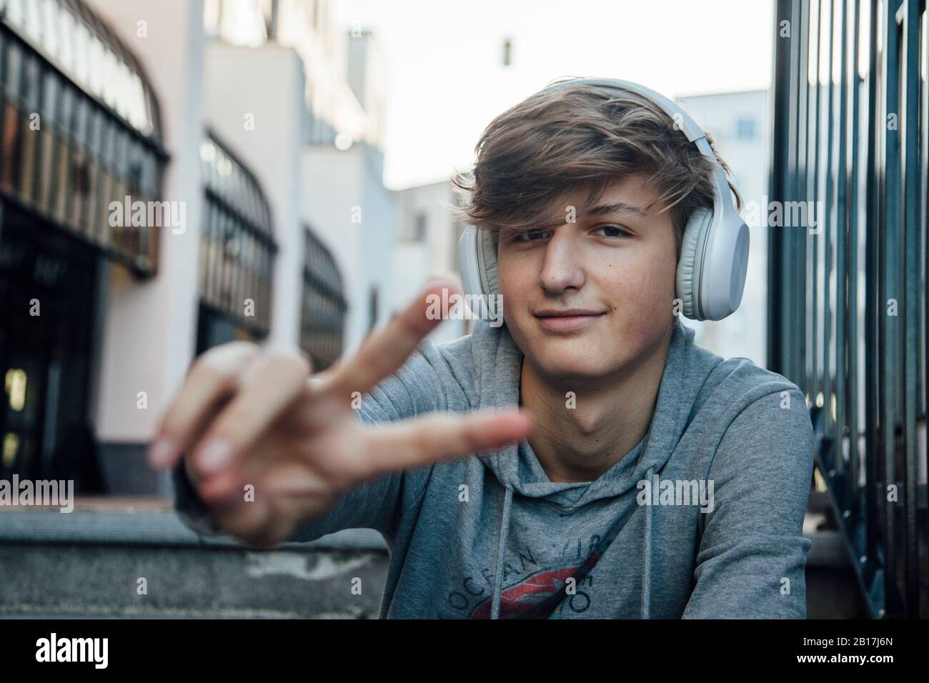 Cool teenage boy hand sign hi-res stock photography and images - Alamy