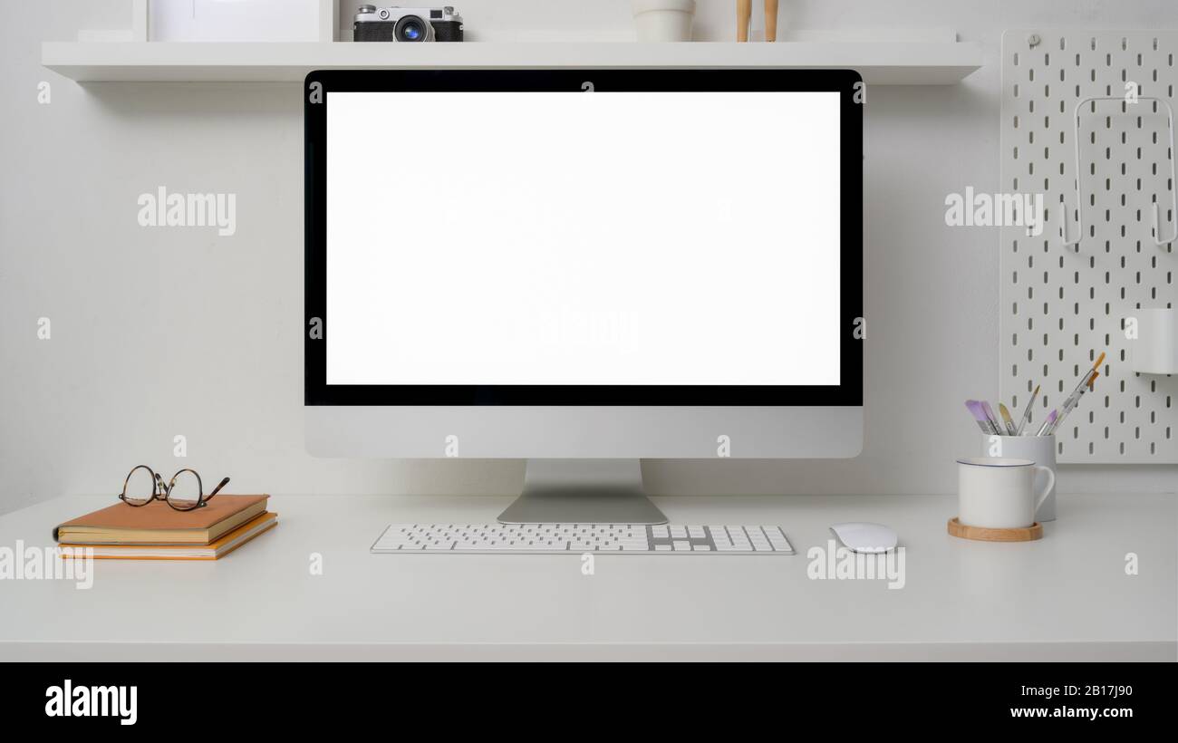 Close up view of minimal workspace with blank screen computer, office ...