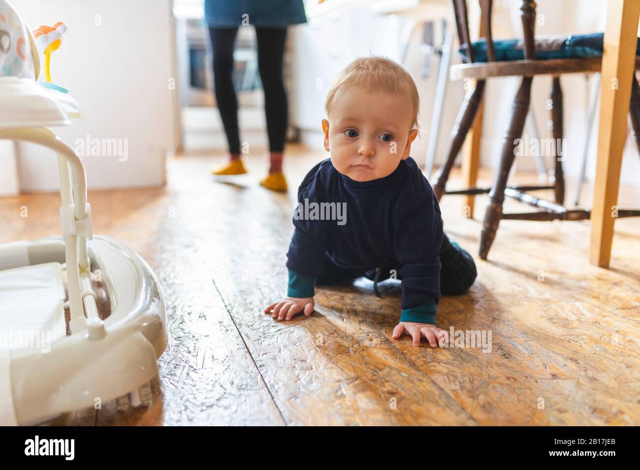 Little boy crawling on the floor at home Stock Photo - Alamy