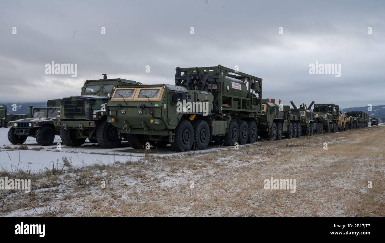 U.S. Marine Corps vehicles from MCCP-N sit staged at Vӕrnes Garnison ...