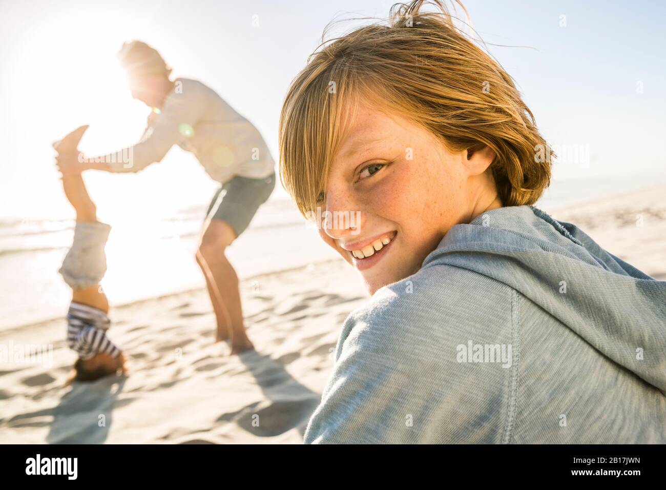 Boy headstand beach hi-res stock photography and images - Alamy