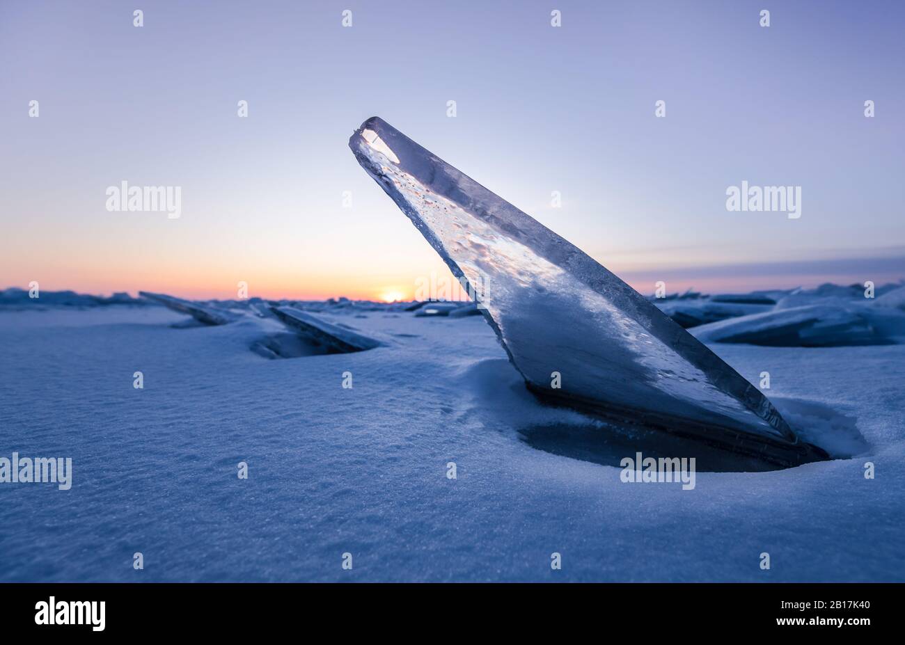 Curious yet beautiful ice formations on lake ice at sunrise. Lake ...