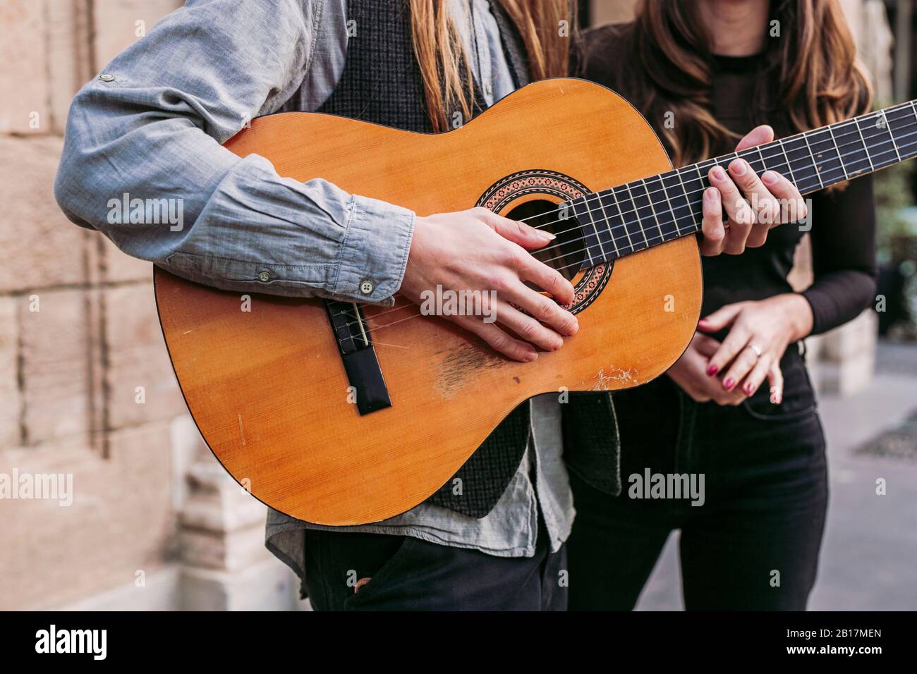 Close-up of two musicians with guitar Stock Photo - Alamy