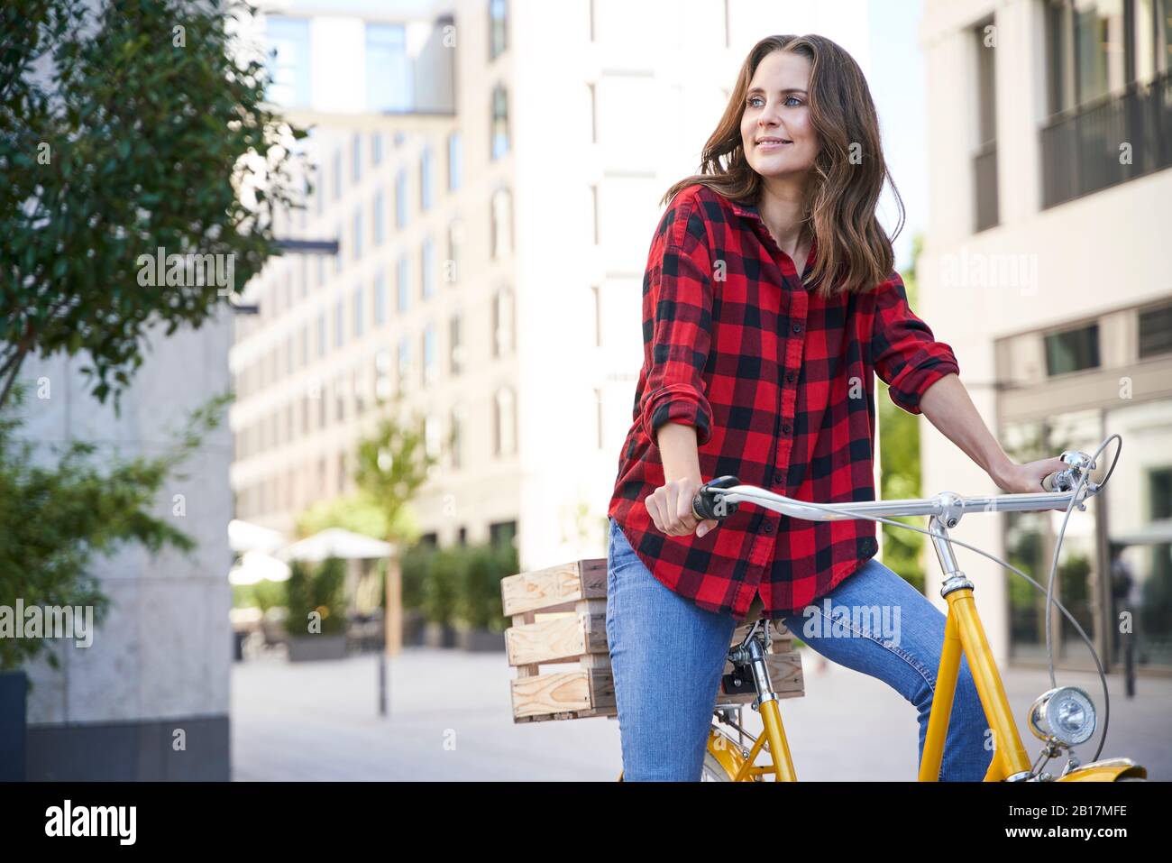 Brunette woman riding bicycle in hi-res stock photography and images ...