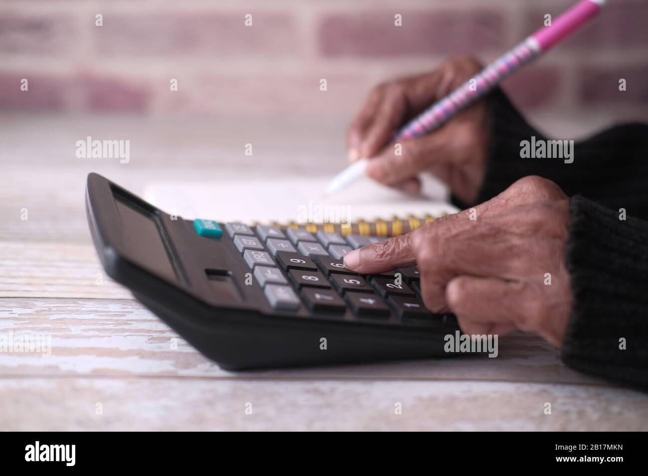 Senior couple calculating calculator hi-res stock photography and ...