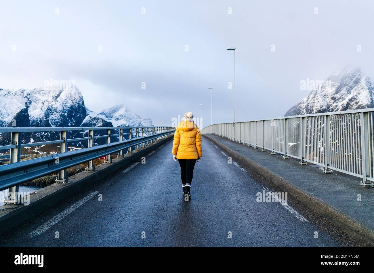 Tourist crossing a bridge at Hamnoy, Lofoten, Norway Stock Photo - Alamy