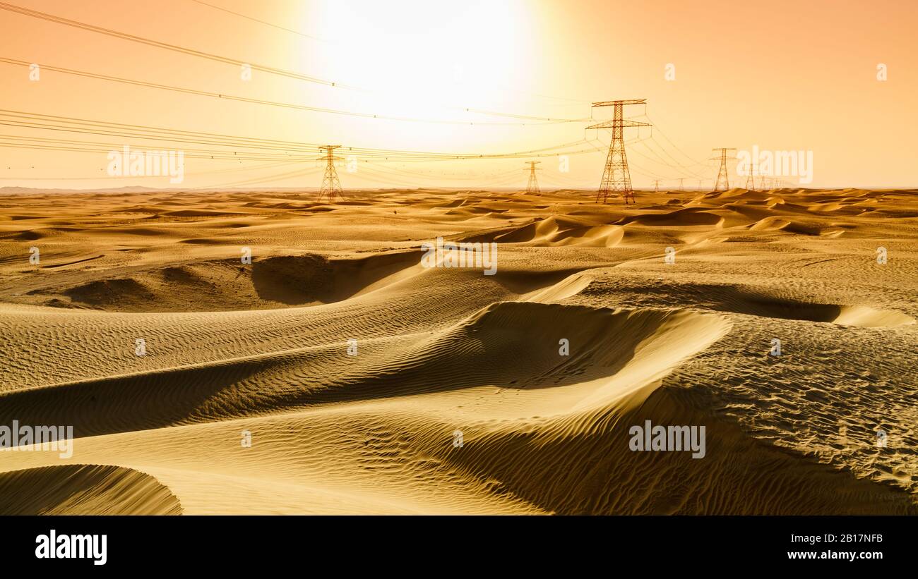 High voltage overhead transmission lines in Abu Dhabi desert Stock ...