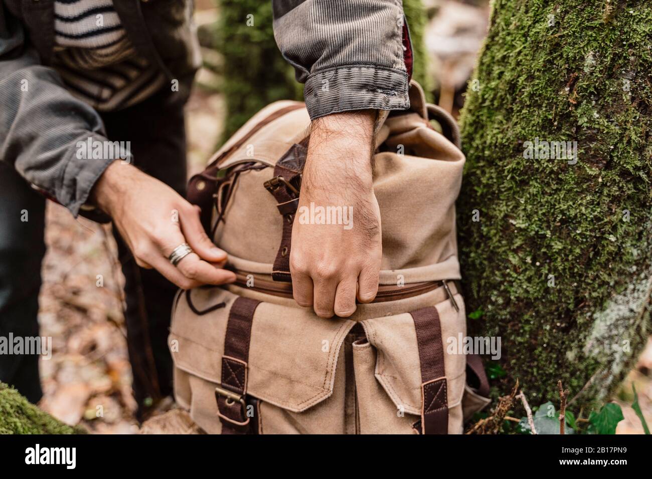 Man closing his backpack hi-res stock photography and images - Alamy