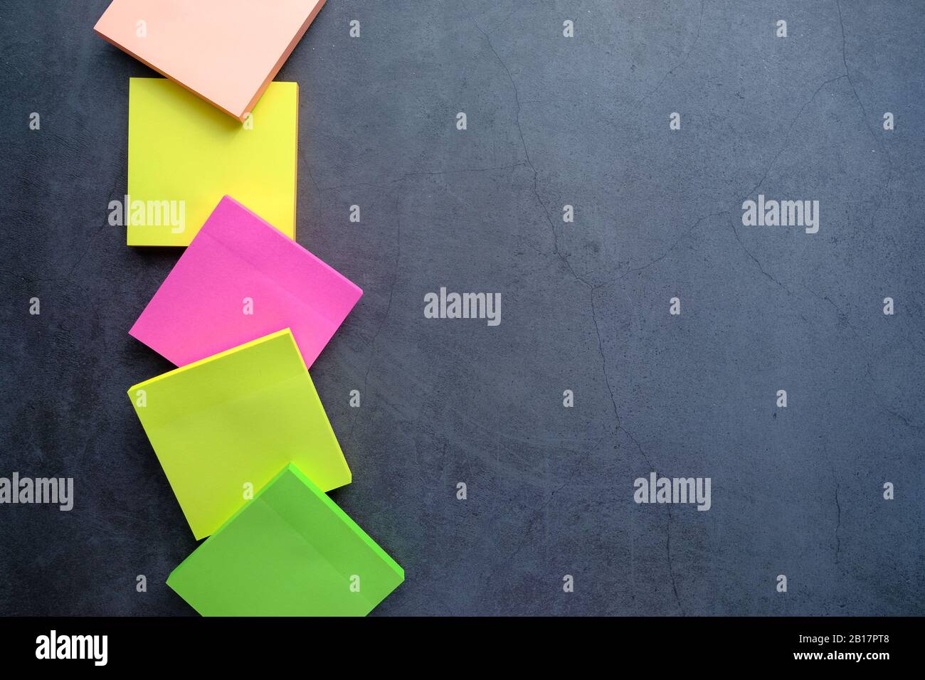 top view of colorful sticky notes on black table with copy space Stock ...