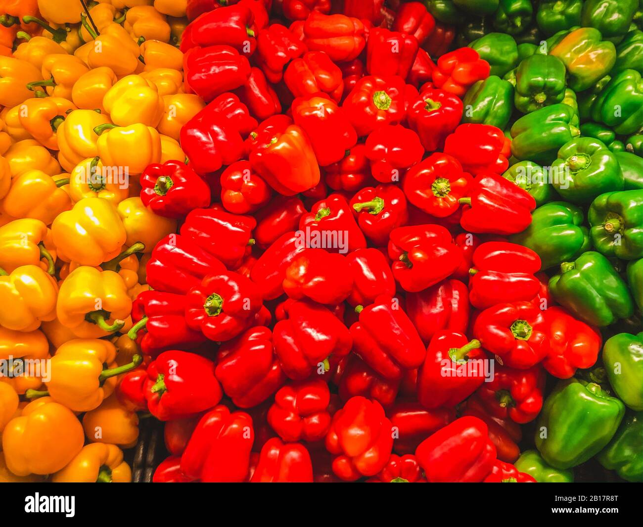 Yellow Red and Green Peppers for sale at local supermarket Stock Photo ...