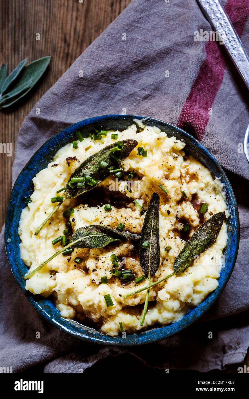 Bowl of mashed potatoes with burnt butter, sage and chive Stock Photo ...