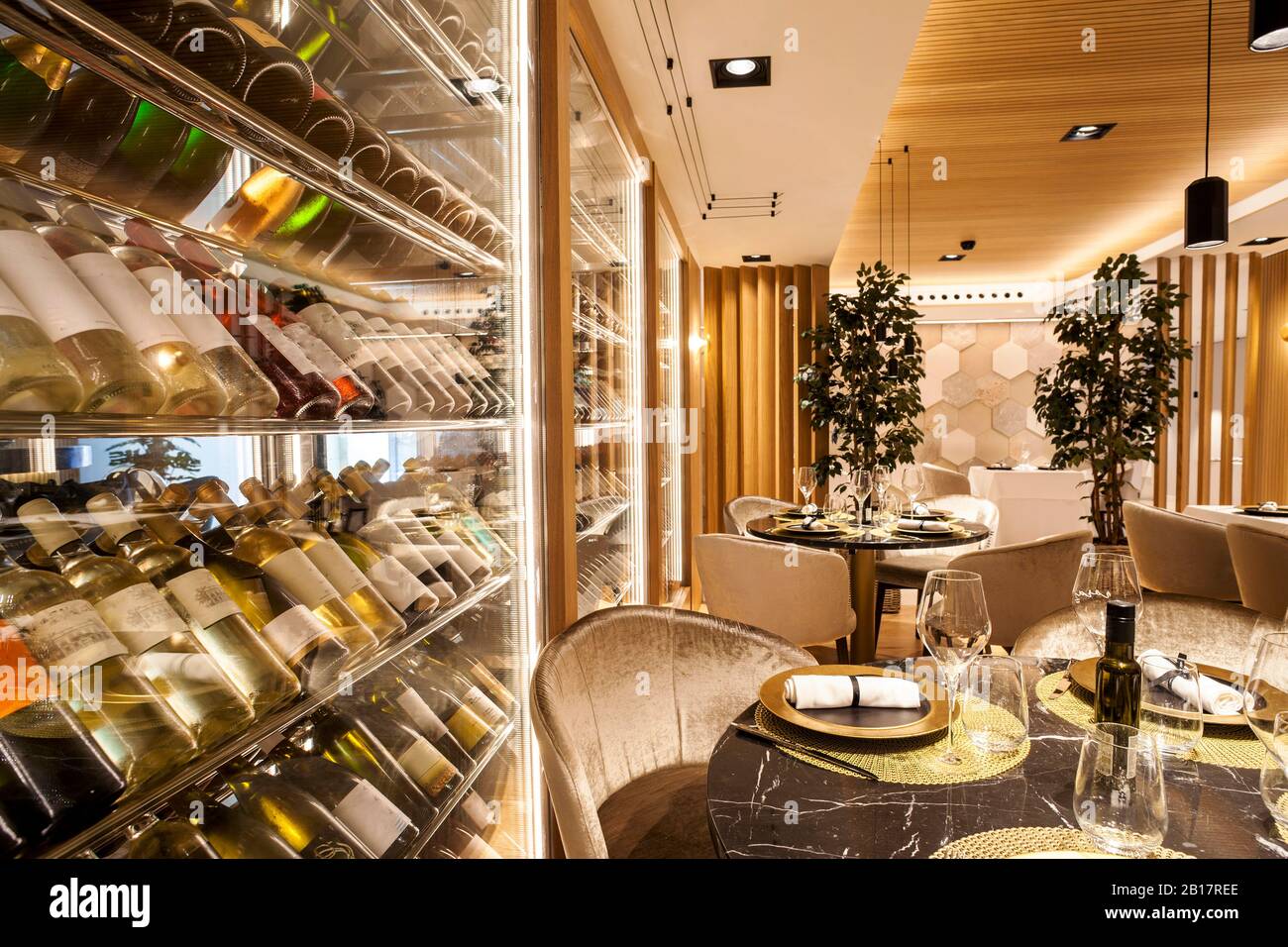 Interior of a fancy restaurant with wine cabinet Stock Photo - Alamy