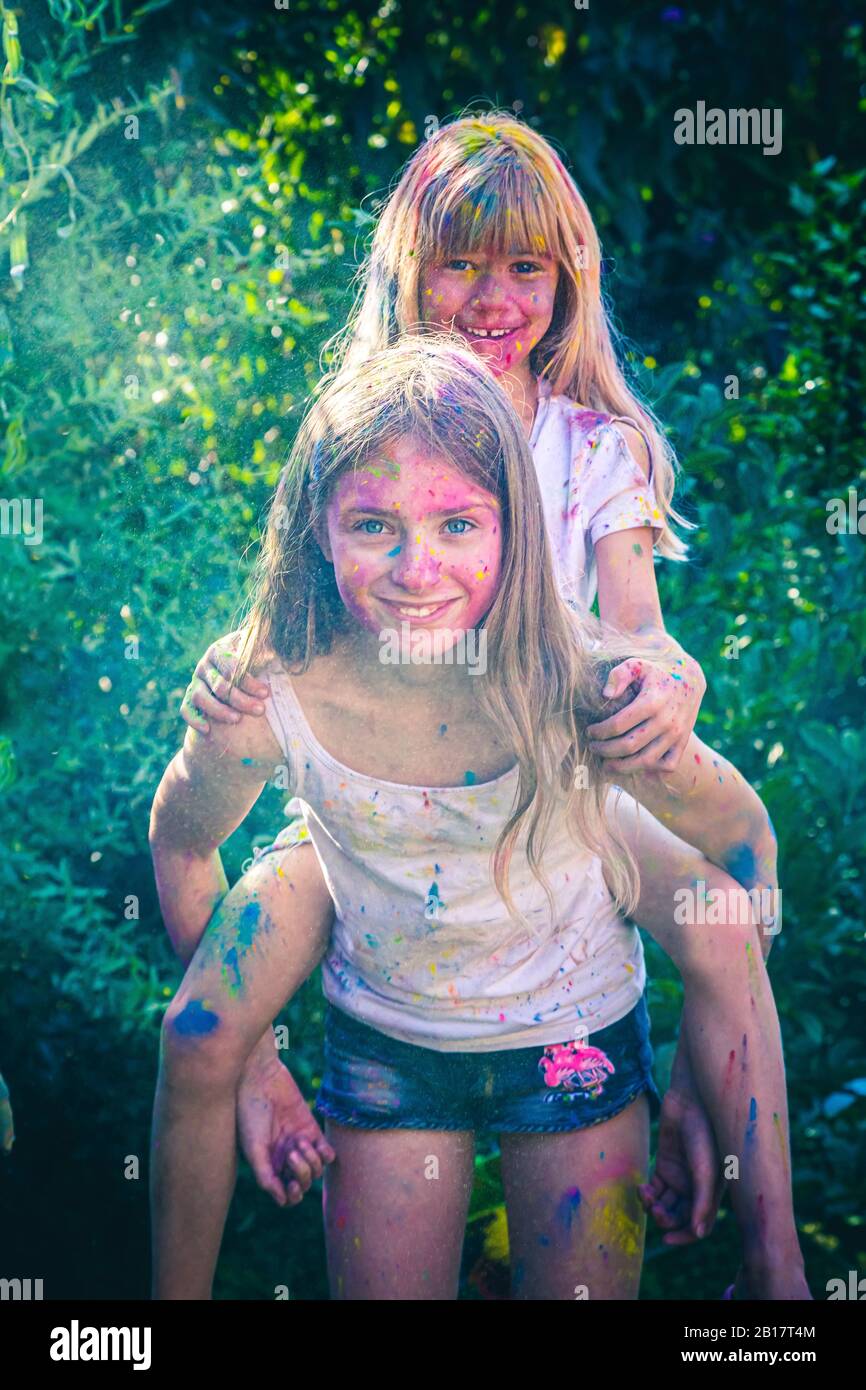 Portrait of two girls celebrating Festival of Colours Stock Photo - Alamy