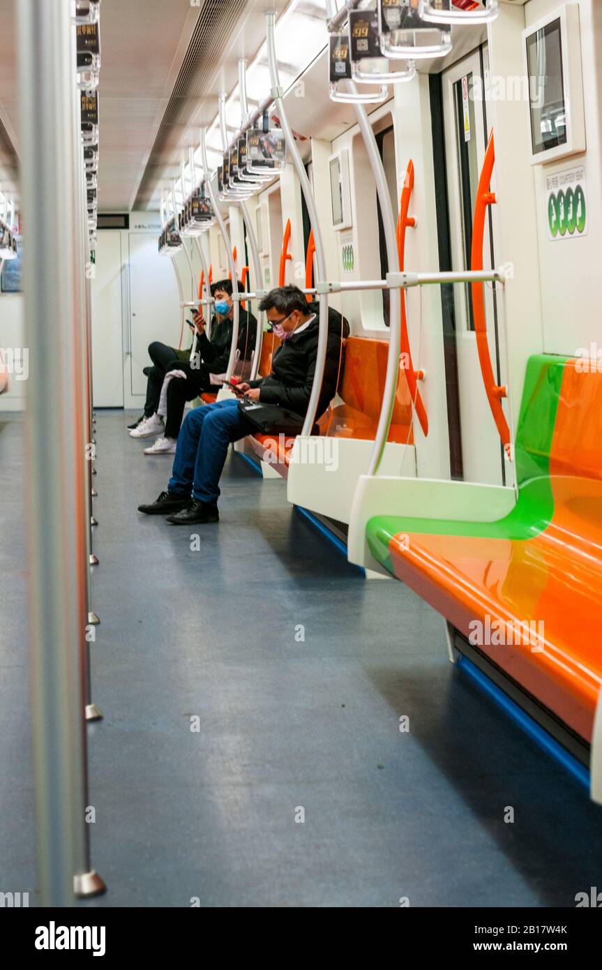 Passengers wearing face masks on a largely empty Line 7 on the Shanghai ...