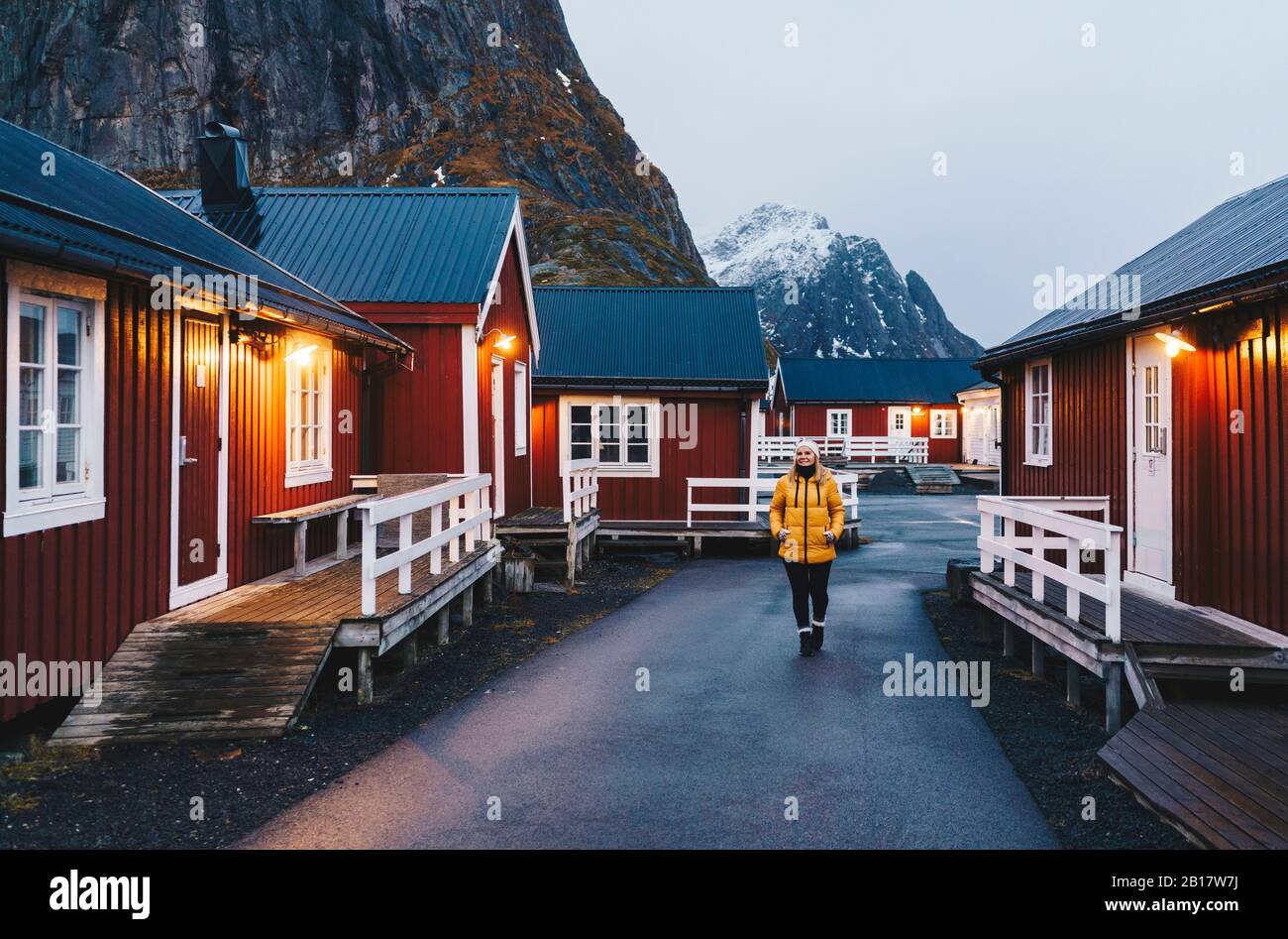 Tourist exploring the fishing village Hamnoy, Lofoten, Norway Stock ...