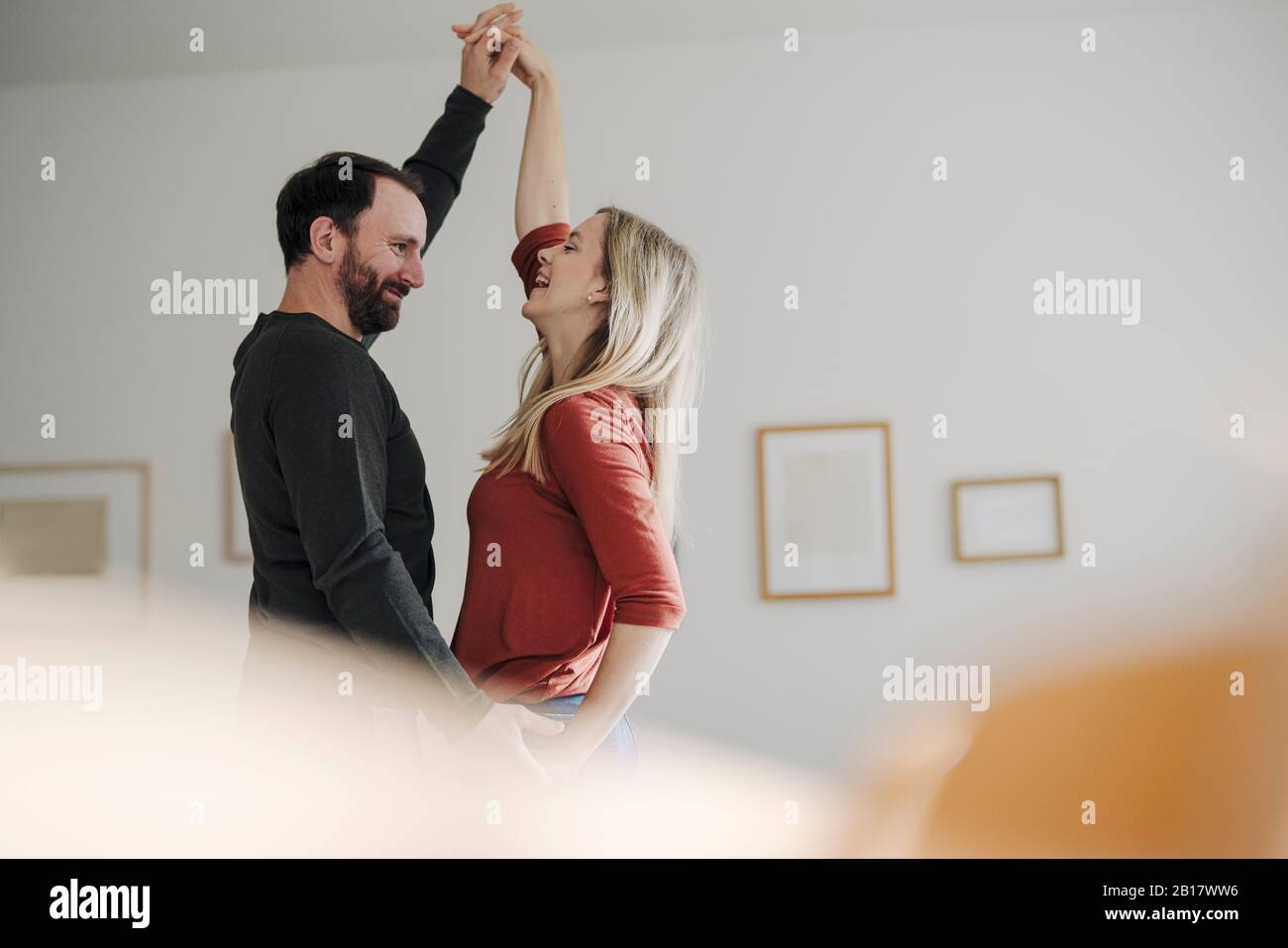 Happy couple dancing at home Stock Photo - Alamy