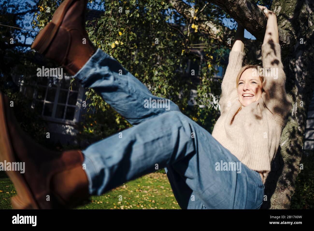Adult woman climbing trees hi-res stock photography and images - Alamy