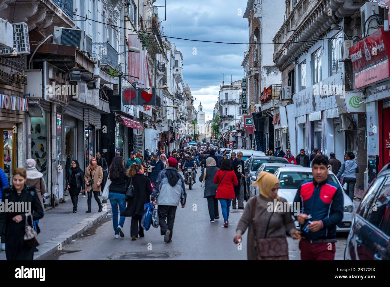 Tunis, Tunisia - People walking along a pedestrian shopping street ...