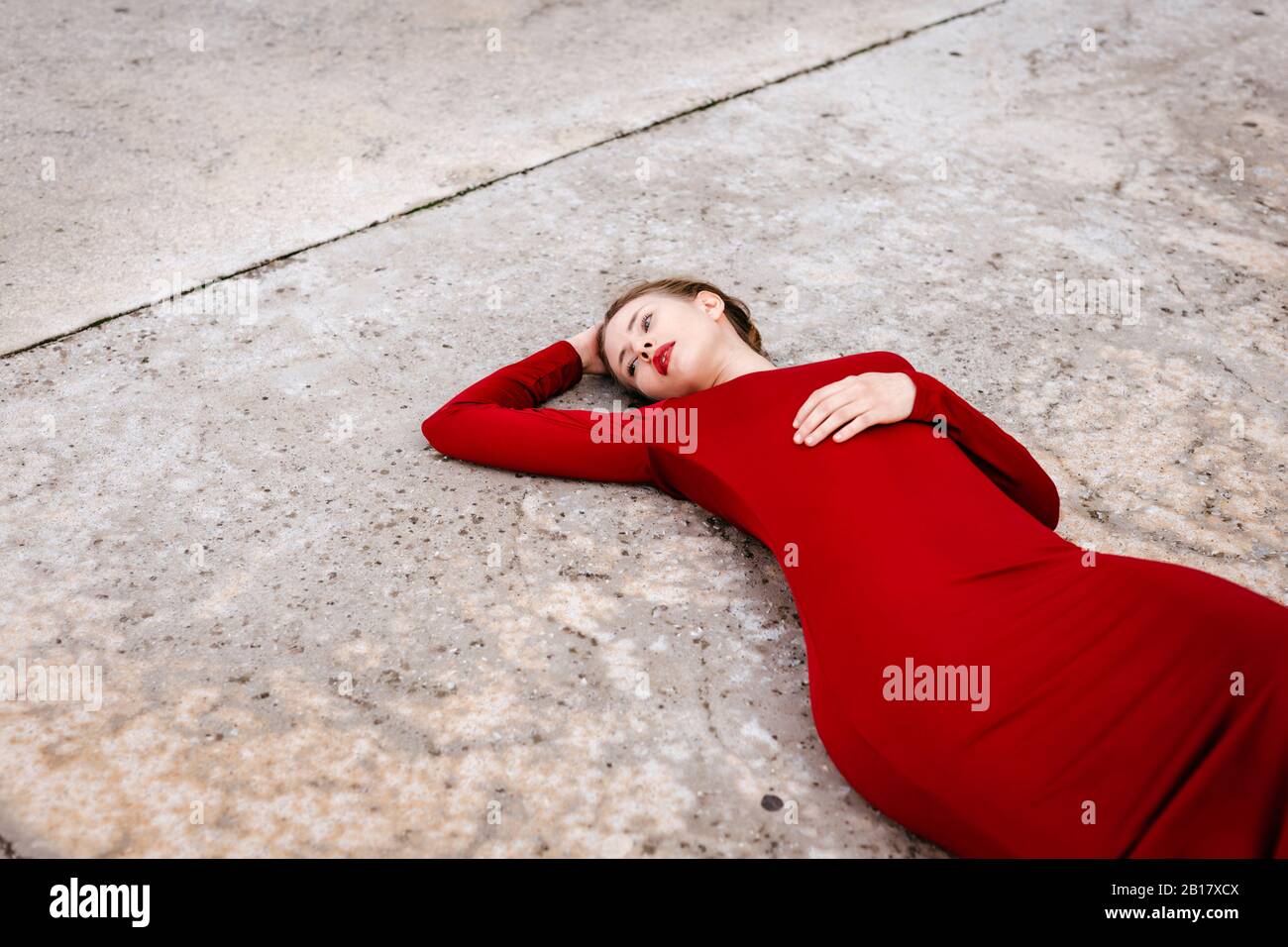 Woman laying on ground hi-res stock photography and images - Alamy