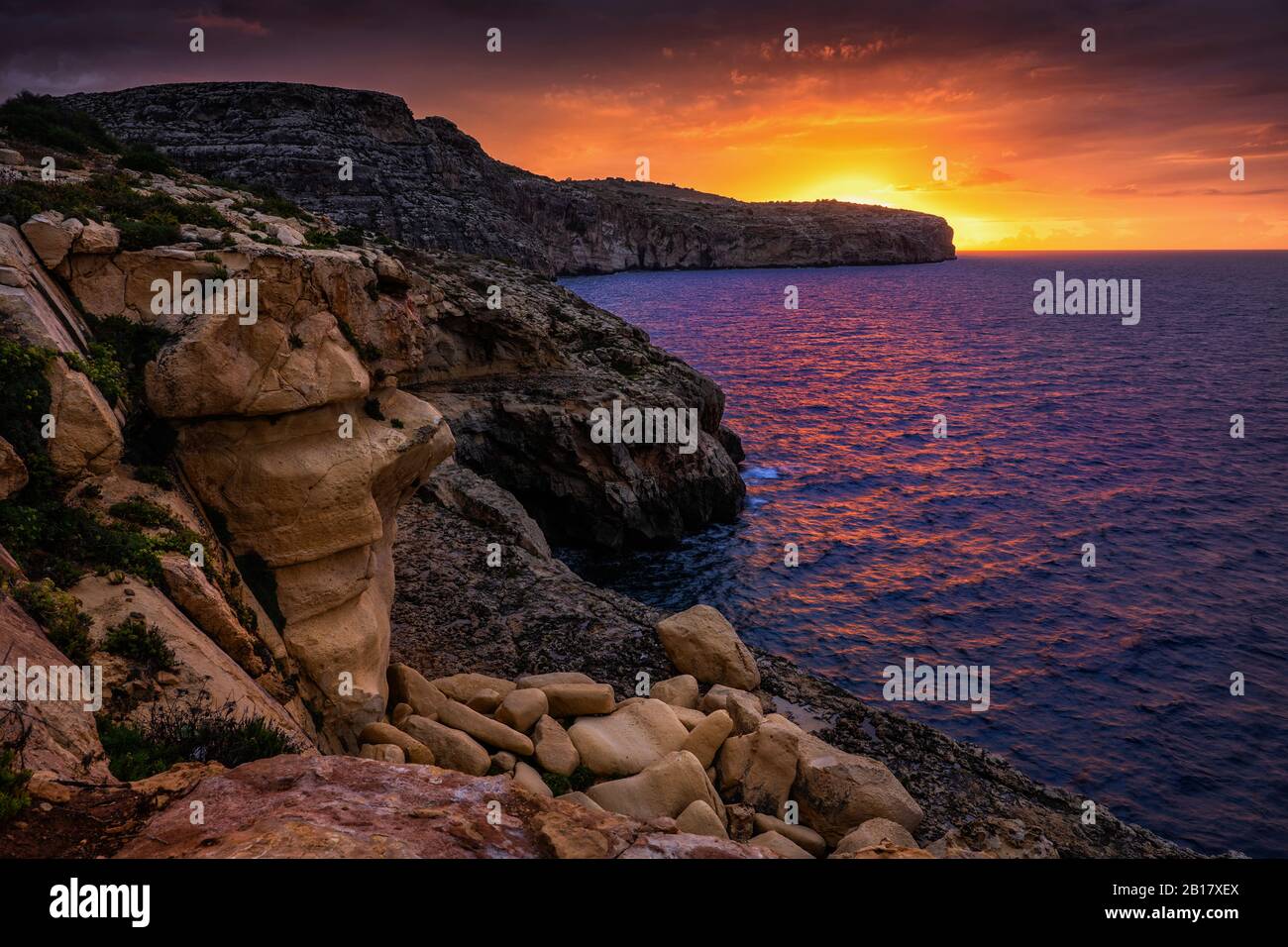 Malta, Rocky shore of Mediterranean Sea at sunrise Stock Photo - Alamy