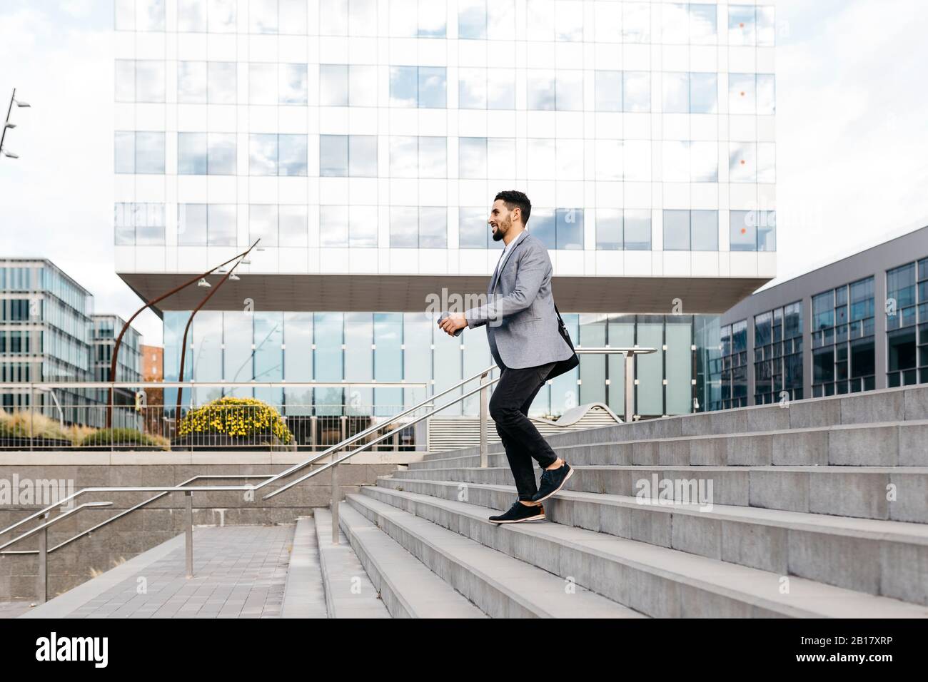 Businessmen walking on stairs hi-res stock photography and images - Alamy