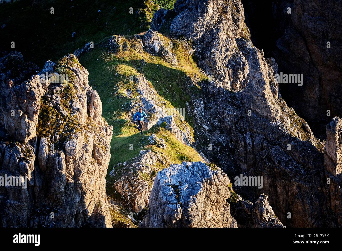 Man running on mountain ridge Stock Photo - Alamy
