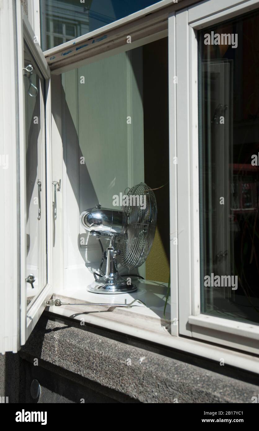 Ventilator standing on window sill Stock Photo - Alamy