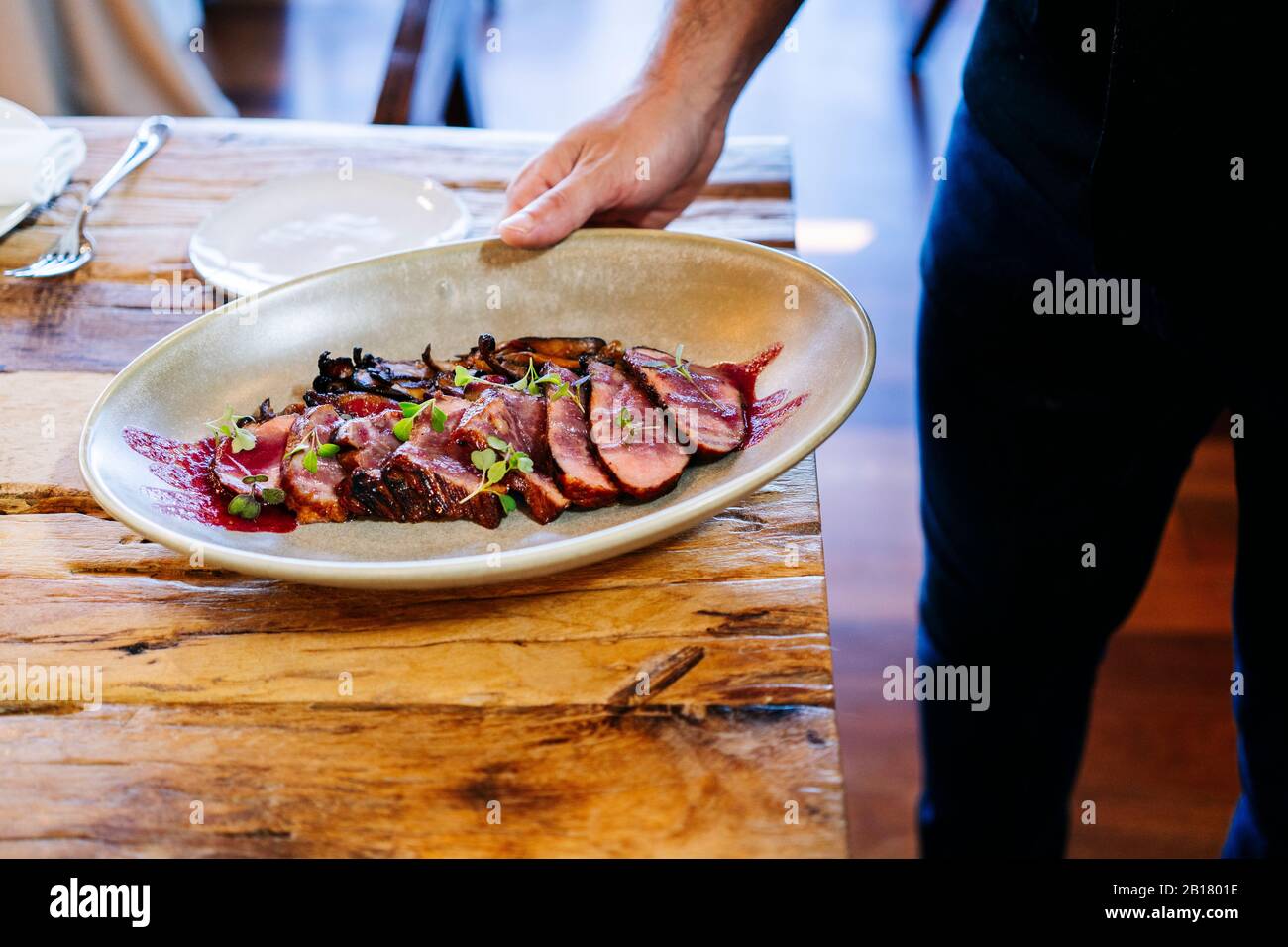 Young man holding dish hi-res stock photography and images - Alamy