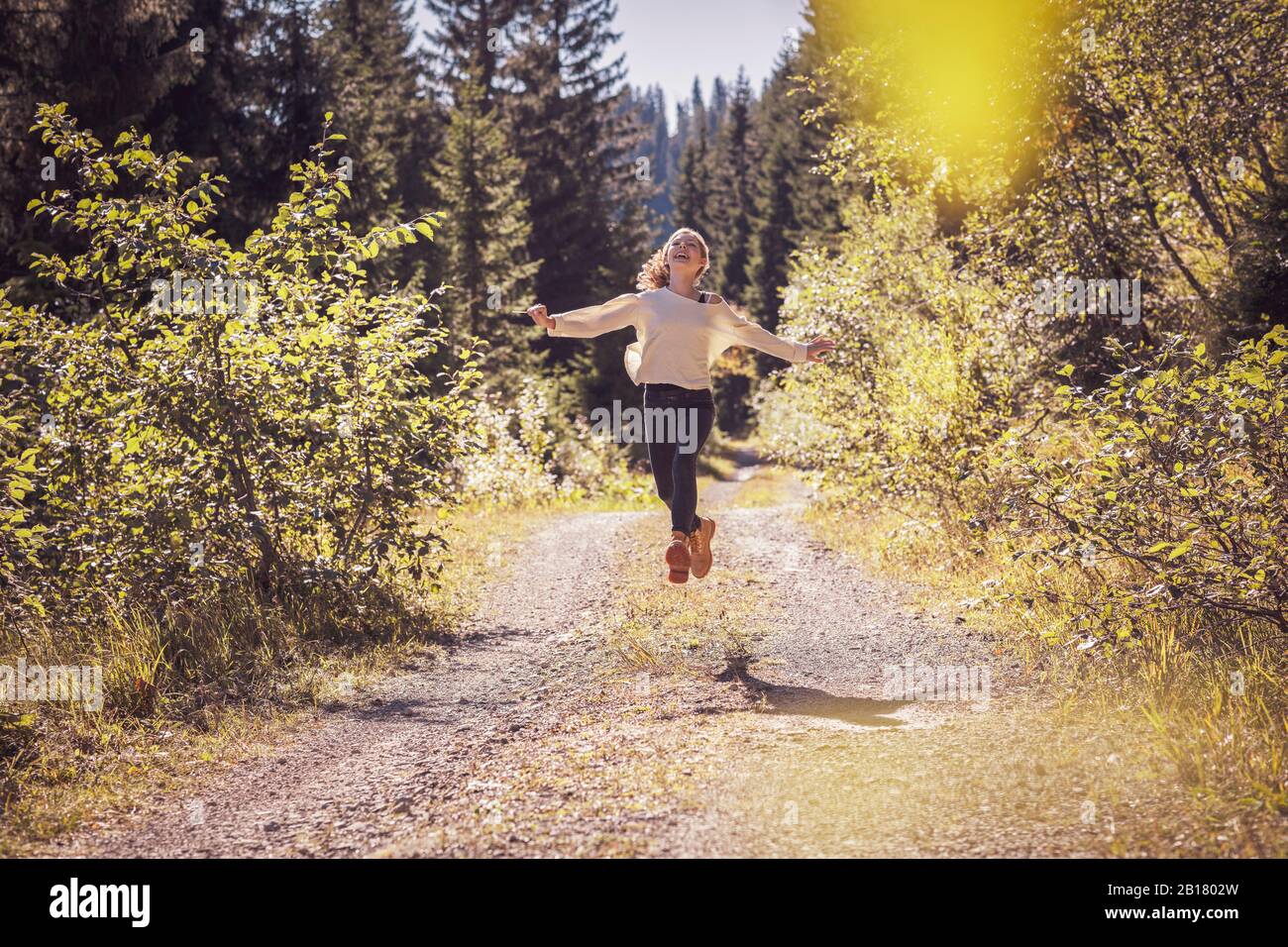 Girl jumping on path hi-res stock photography and images - Alamy