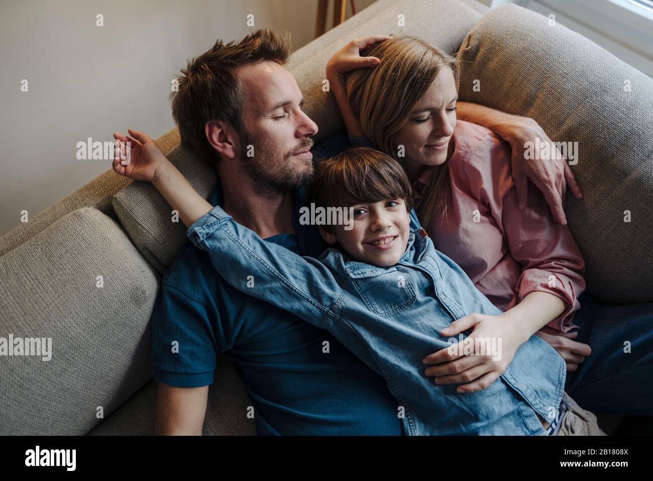 Loving family snuggling on hi-res stock photography and images - Alamy