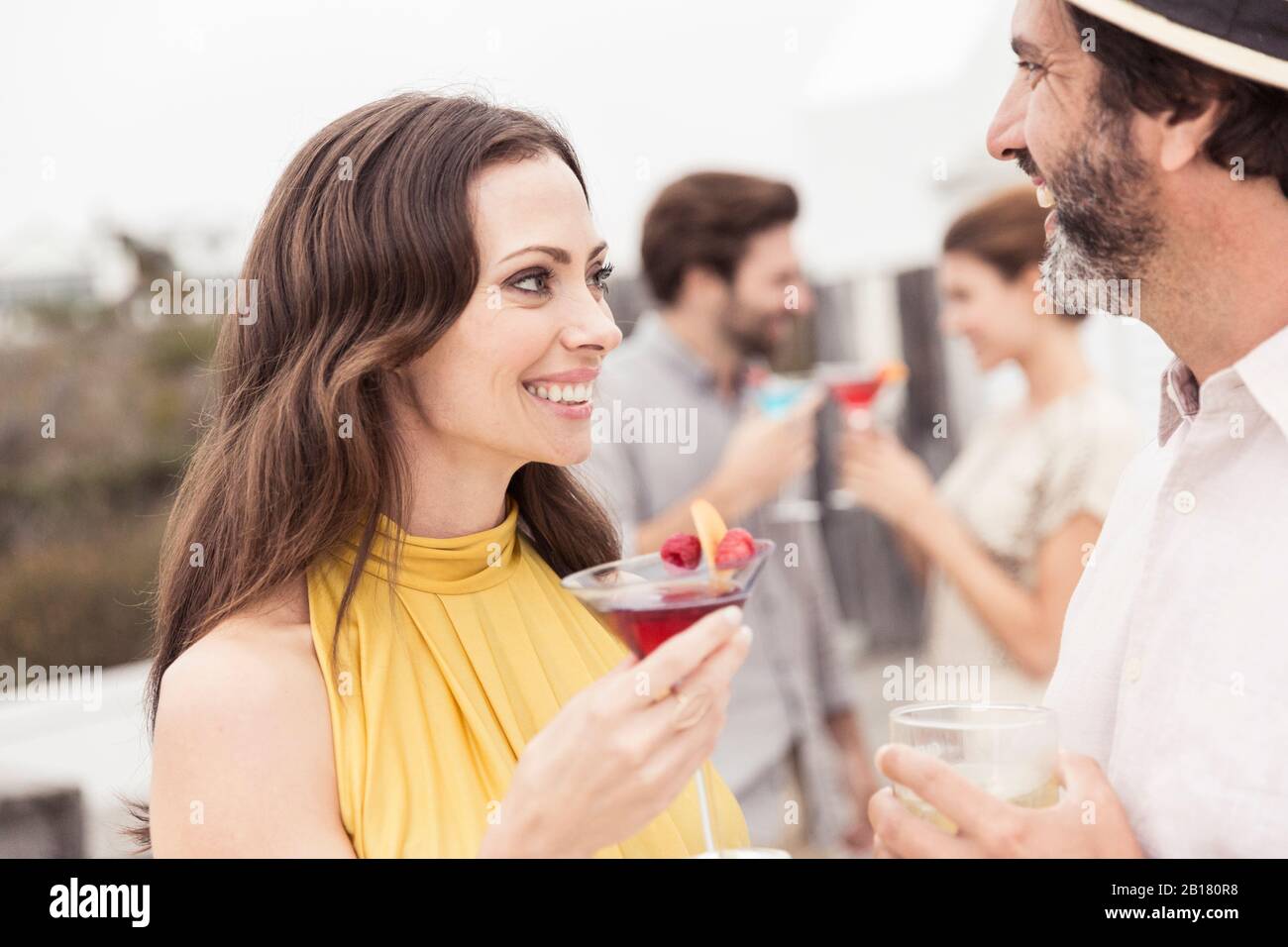 Couple cocktail party hi-res stock photography and images - Alamy