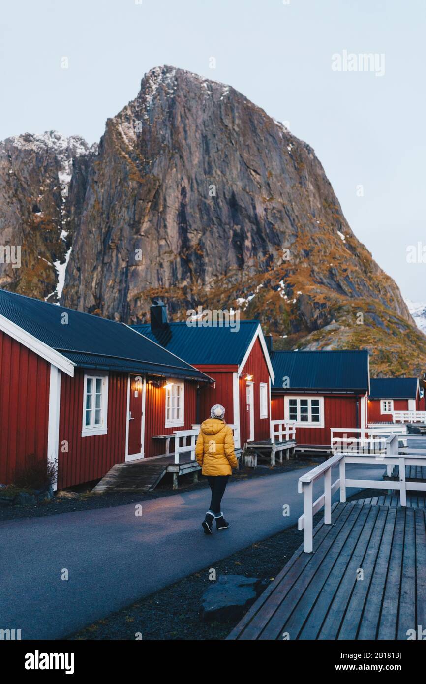 Tourist exploring the fishing village Hamnoy, Lofoten, Norway Stock ...