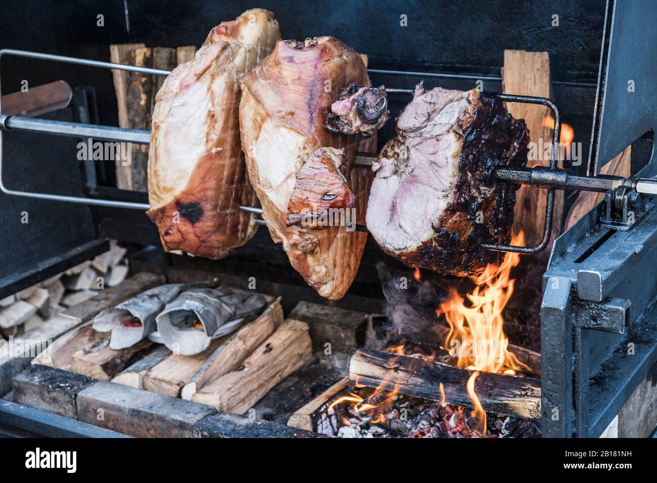 Close up pork spit roasting outdoors hi-res stock photography and ...