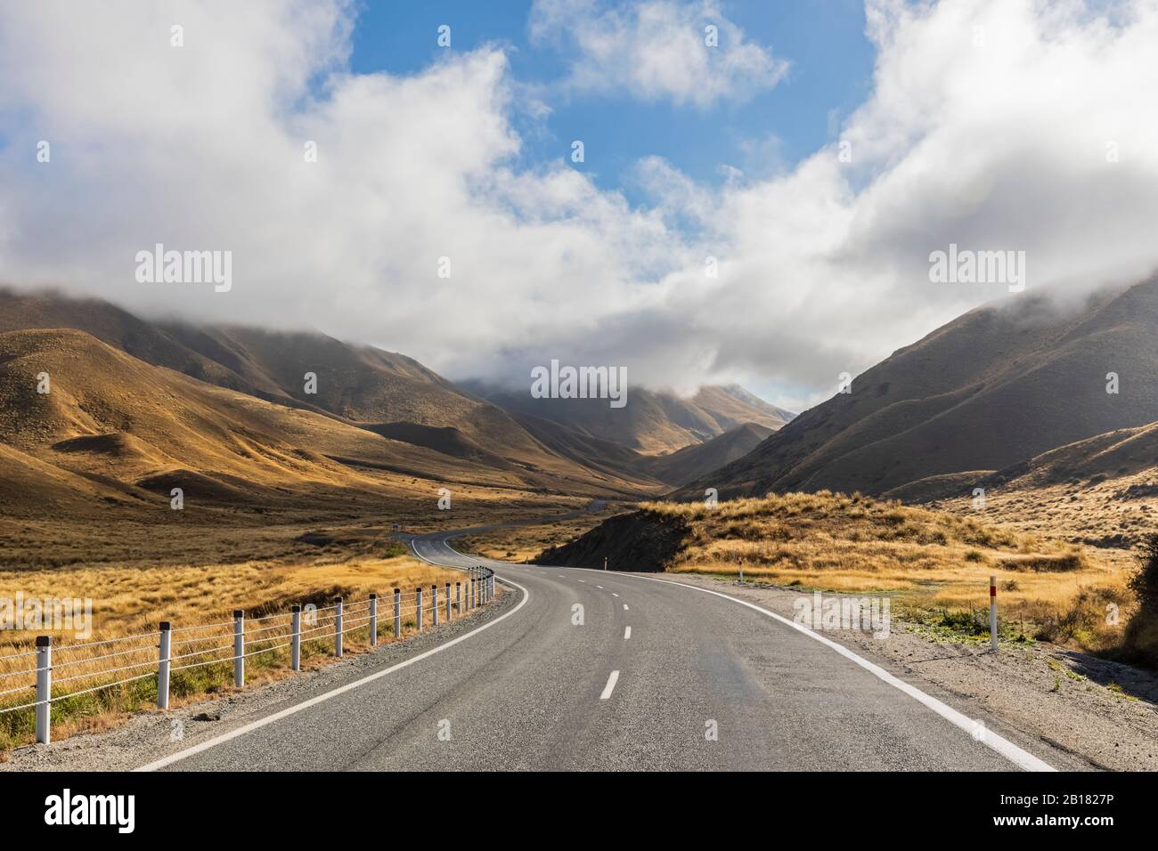 New Zealand, Clouds over empty State Highway 8 in Lindis Pass Stock ...