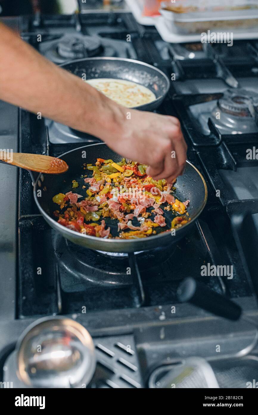 Interior of a kitchen with a young chef at work hi-res stock ...