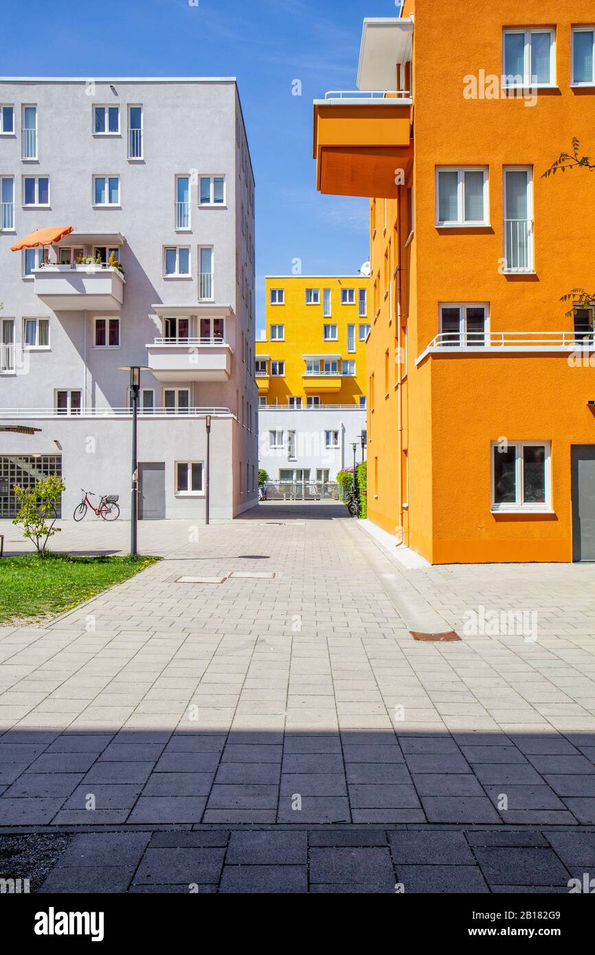 Germany, Bavaria, Munich, Pavement in front of apartment buildings in ...