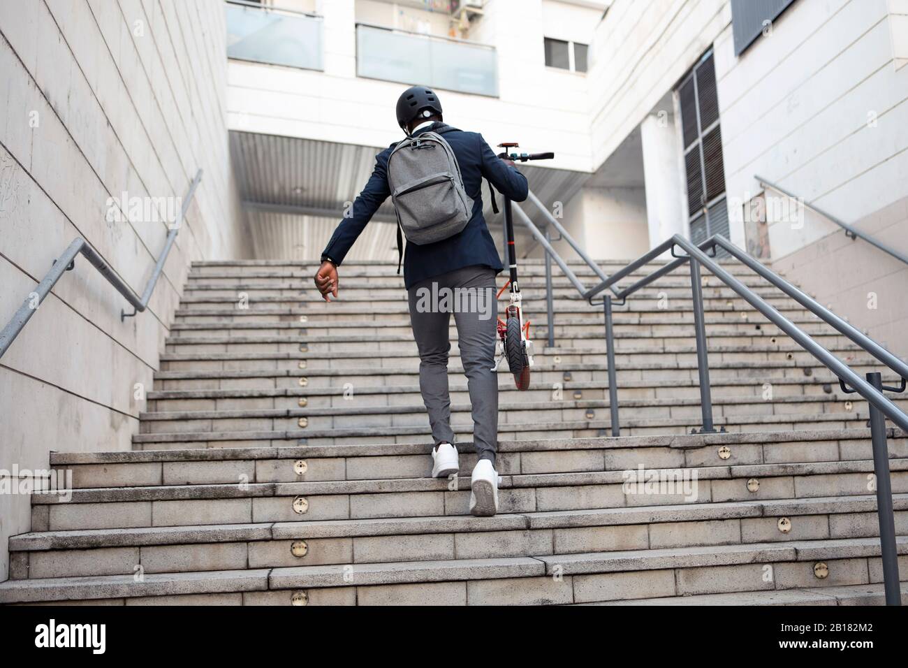 Person walking upstairs hi-res stock photography and images - Alamy
