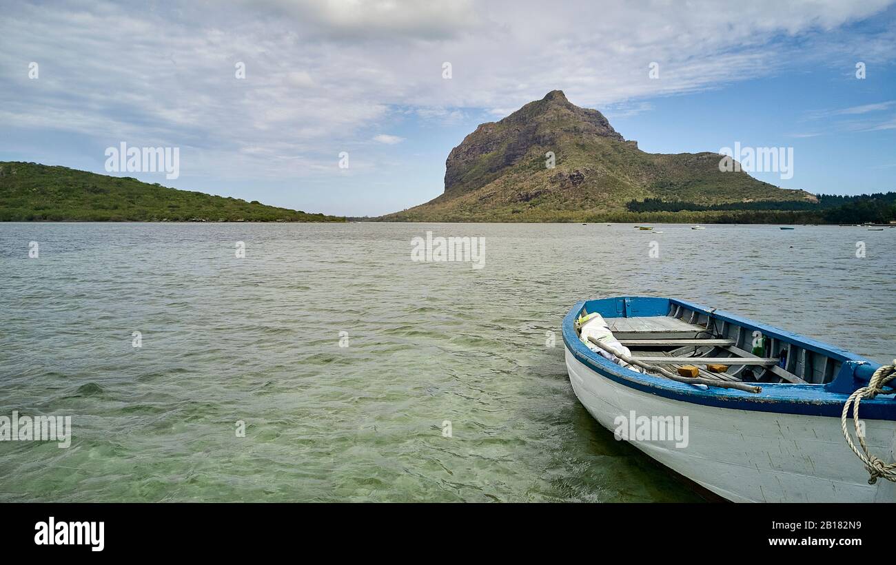 Empty rowboat floating water le morne brabant peninsula background hi ...