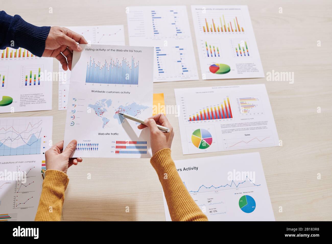 Hands of businessman giving document with website visiting activity ...