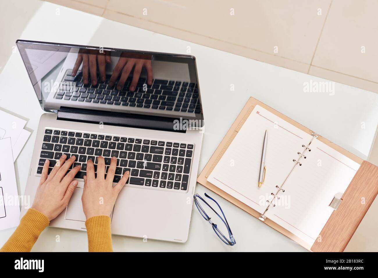 Hands of female back end developer working on laptop with her opened ...