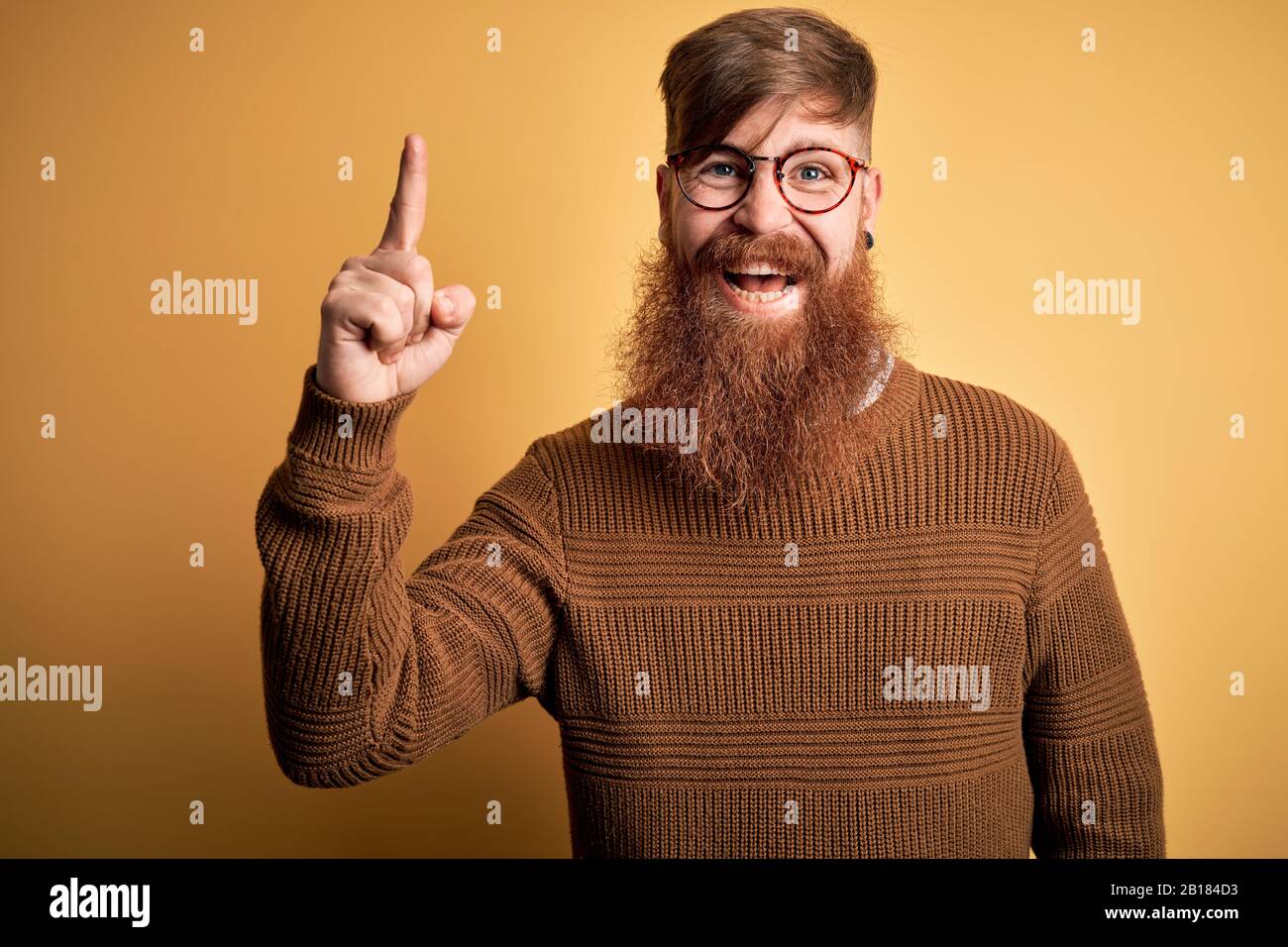Handsome Irish Redhead Man With Beard Wearing Glasses And Winter