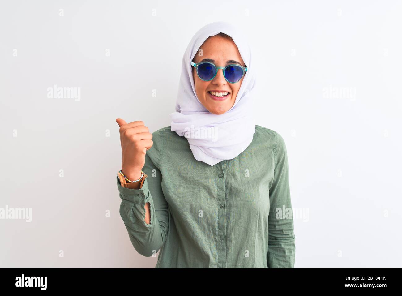 Young Arab woman wearing hijab and summer sunglasses over isolated ...