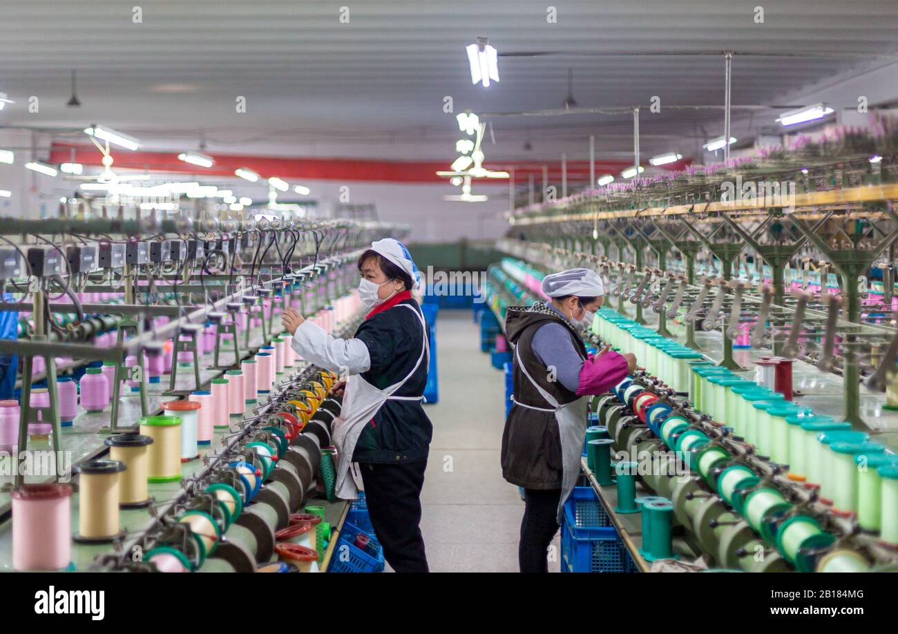 Female Chinese workers deal with production of silk at the plant of ...