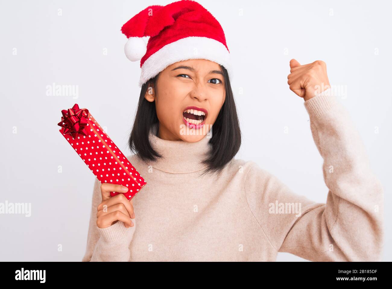 Young chinese cleaner woman wearing gloves holding mop over isolated ...