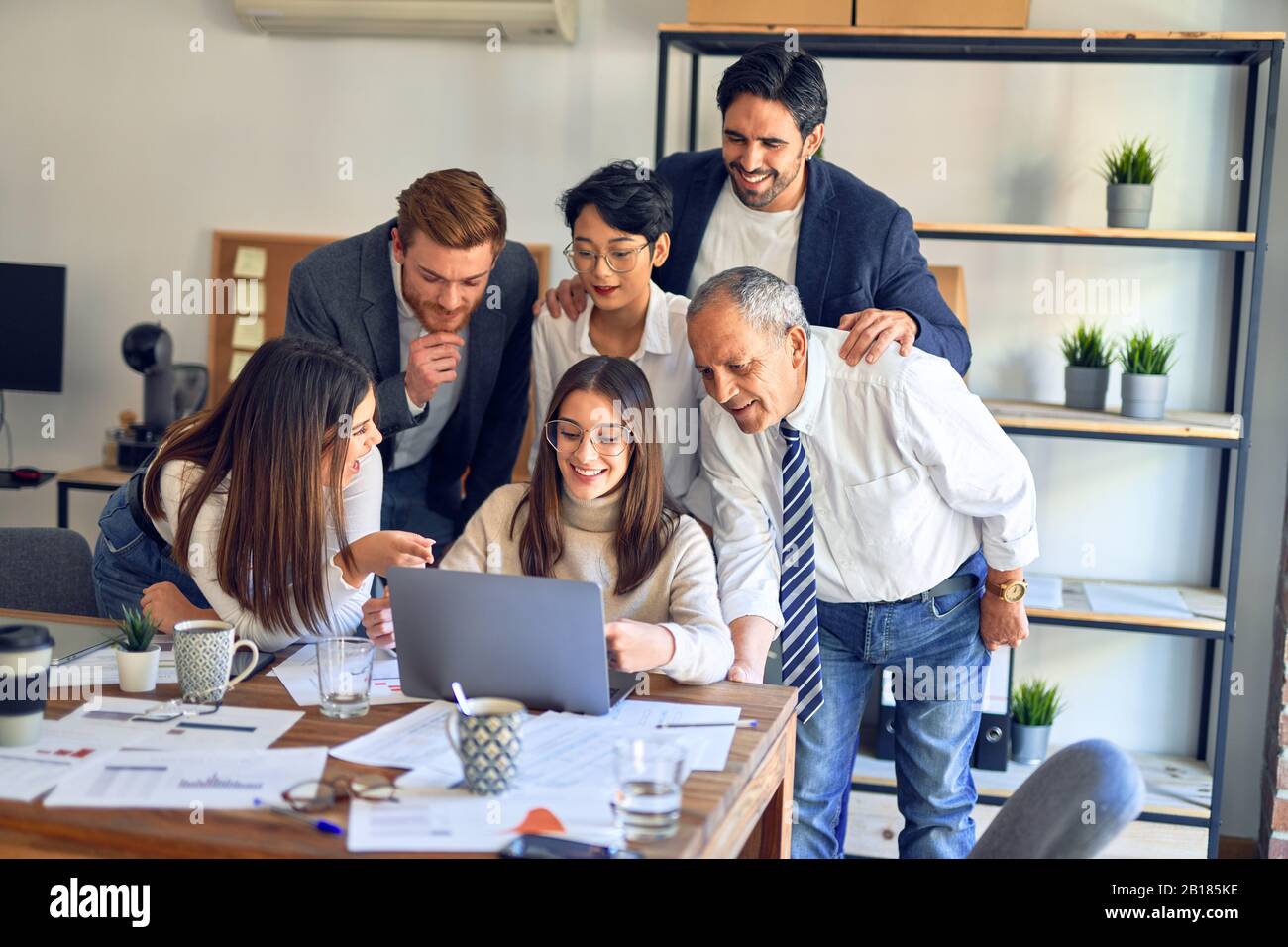 Group of business workers smiling happy and confident. One of them ...