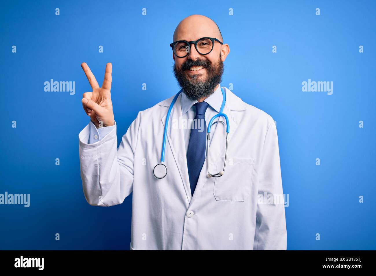 Handsome Bald Doctor Man With Beard Wearing Glasses And Stethoscope