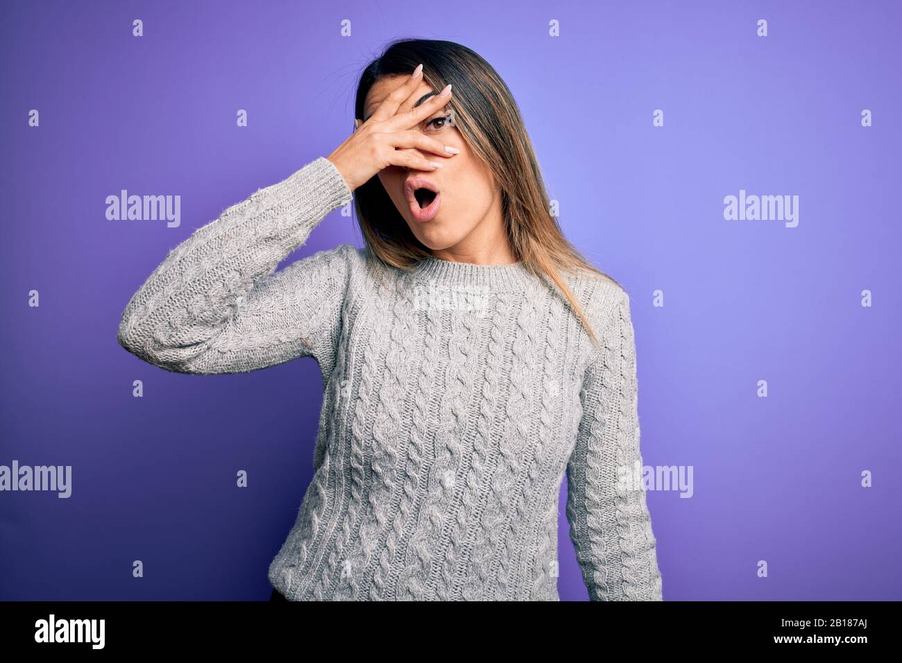 Young beautiful woman wearing casual sweater standing over isolated ...