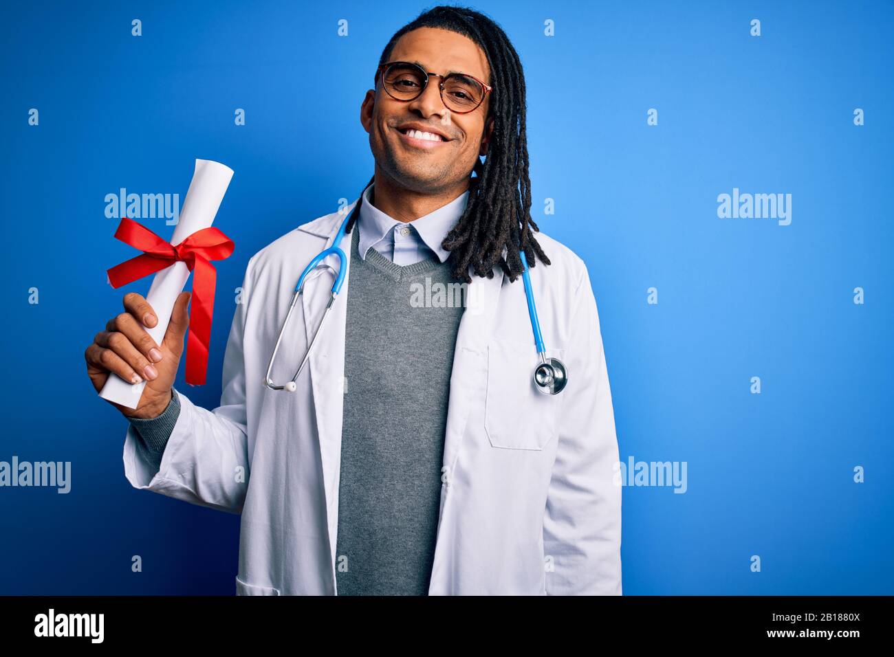African american doctor man with dreadlocks wearing stethoscope holding ...