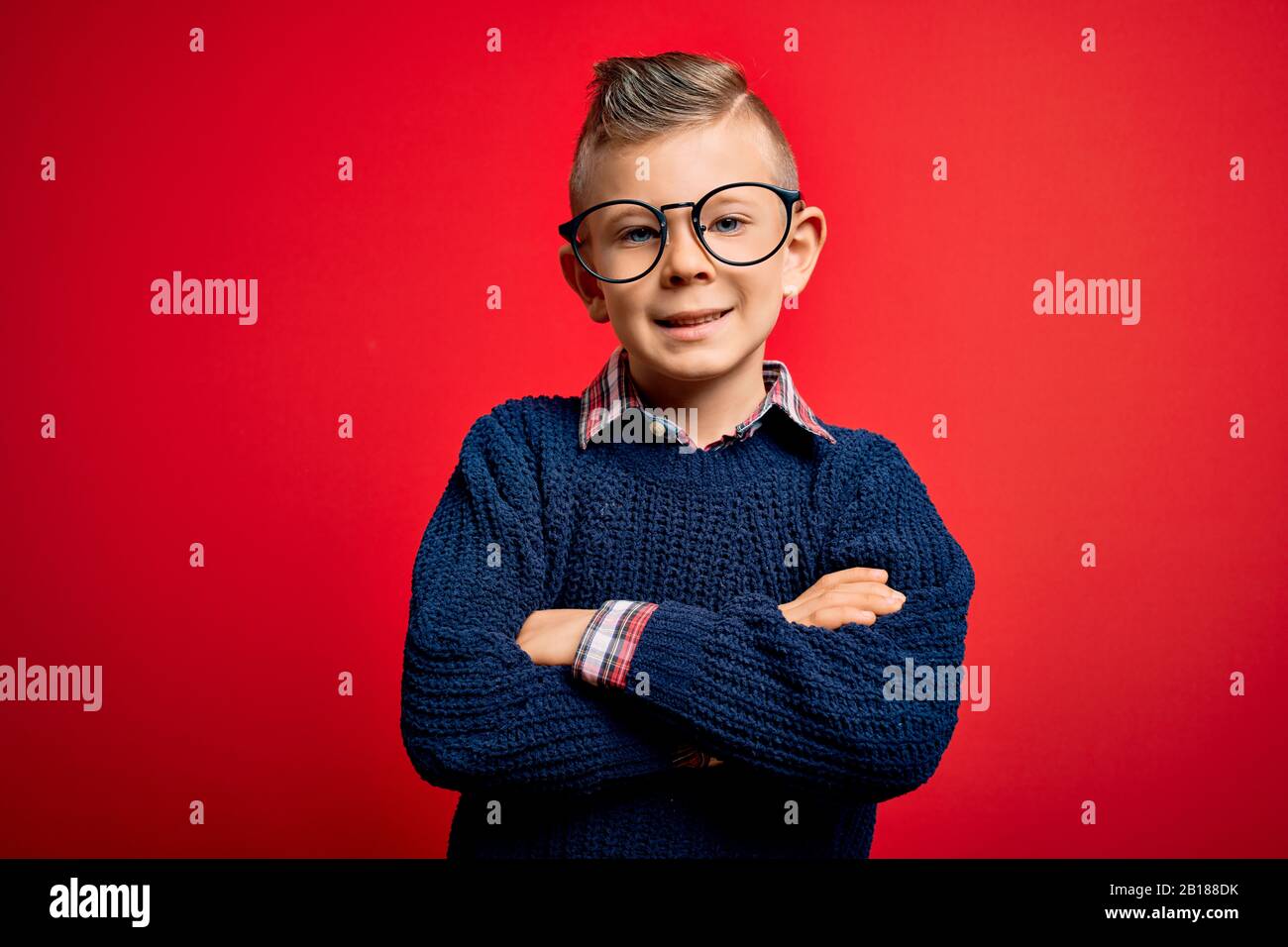 Young little caucasian kid with blue eyes standing wearing smart ...
